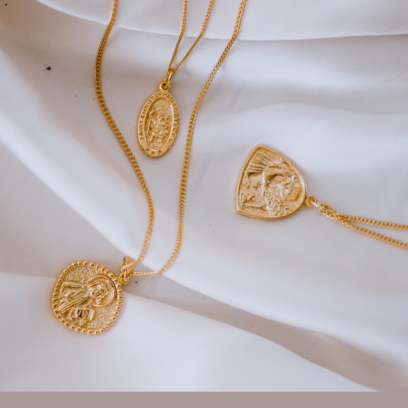 THE STORY BEHIND THE SAINT PENDANTS